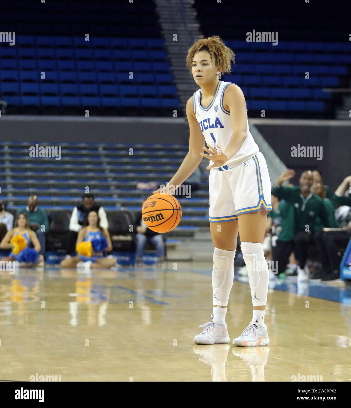 December 21, 2023 - UCLA Bruins guard Kiki Rice #1 calls a play during ...