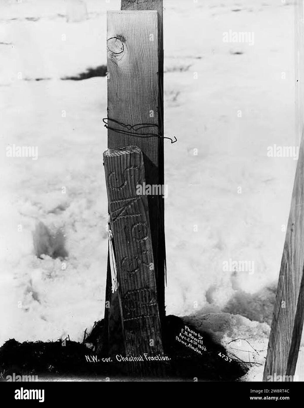 Wooden stake with snow in background, possibly mining claim, Nome ...