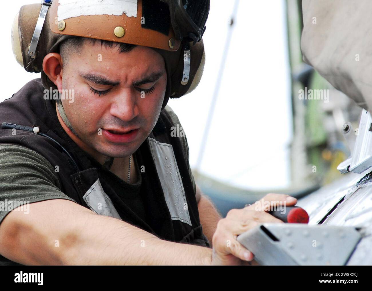 Working hard washing a helicopter Stock Photo - Alamy