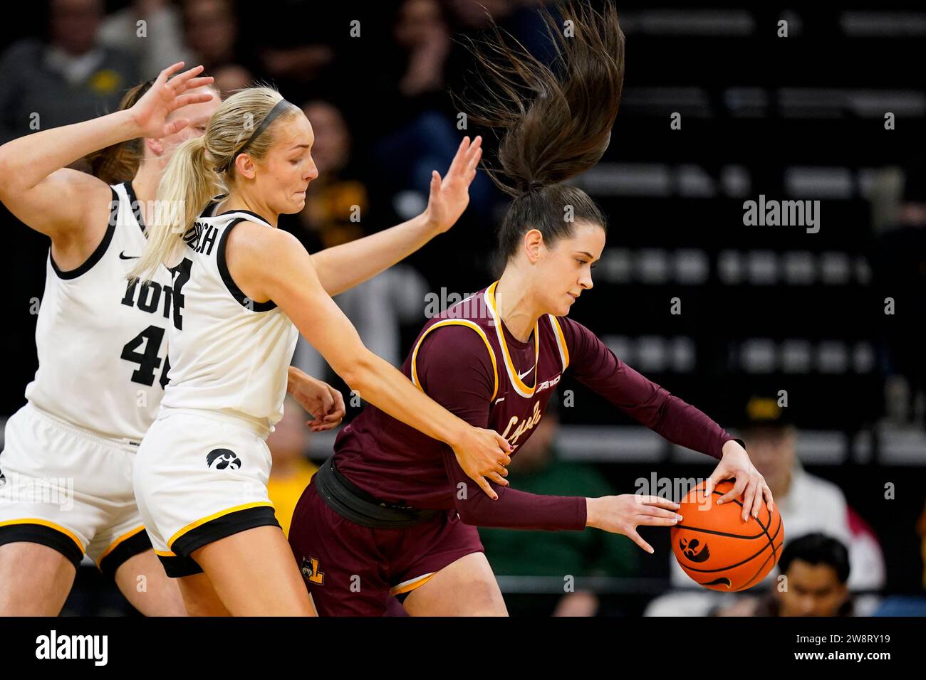 Loyola of Chicago forward Sophia Nolan (14) fights for a loose ball ...