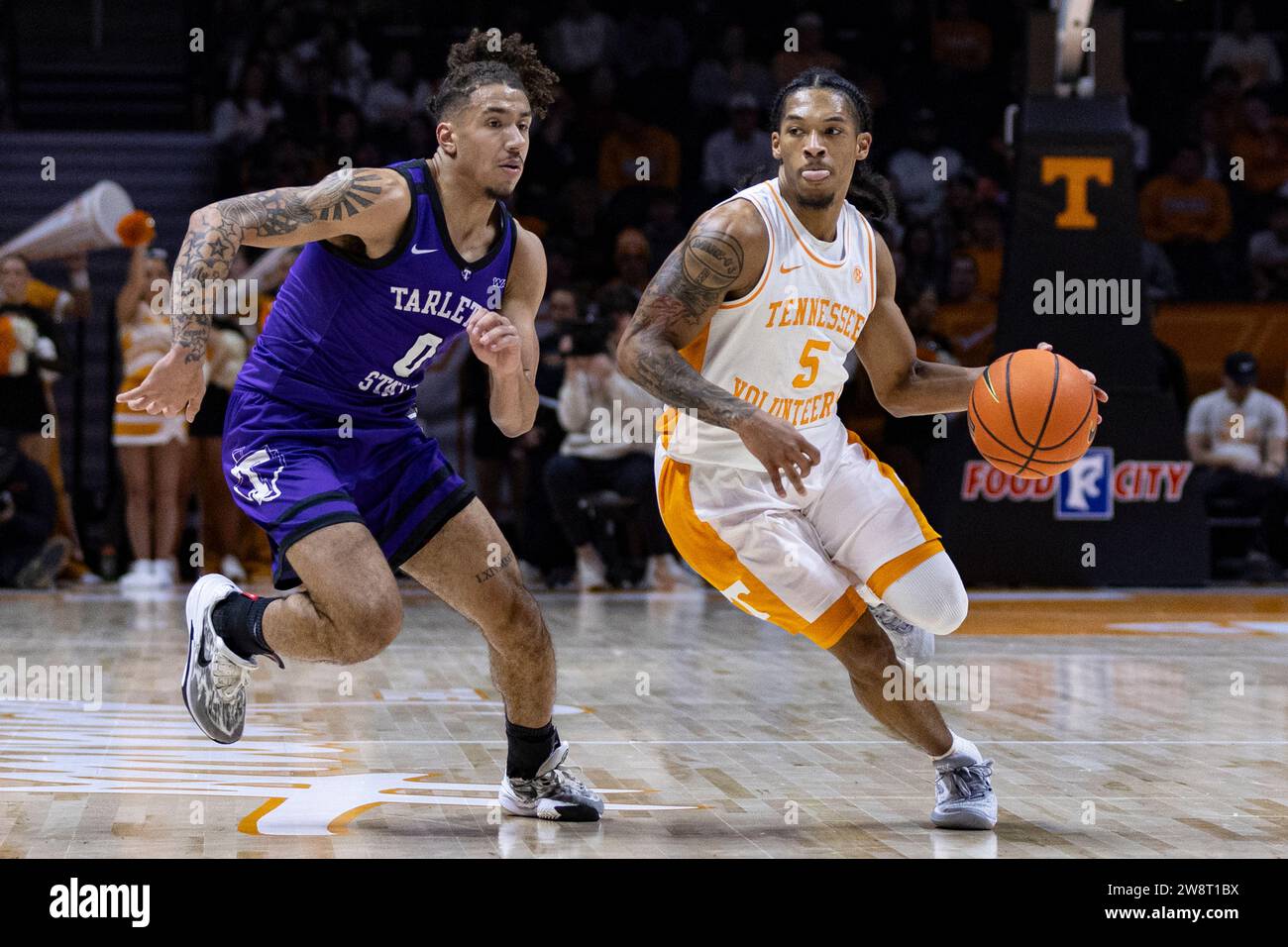 Tennessee guard Zakai Zeigler (5) drives against Tarleton State guard Izzy Miles (0) during the ...