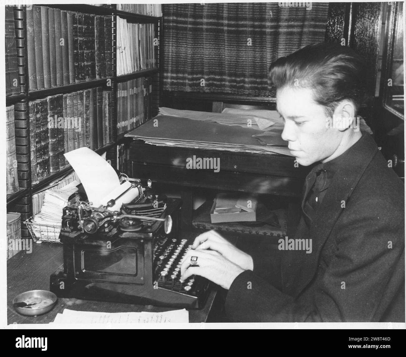 WPA worker typing old historical records Stock Photo - Alamy