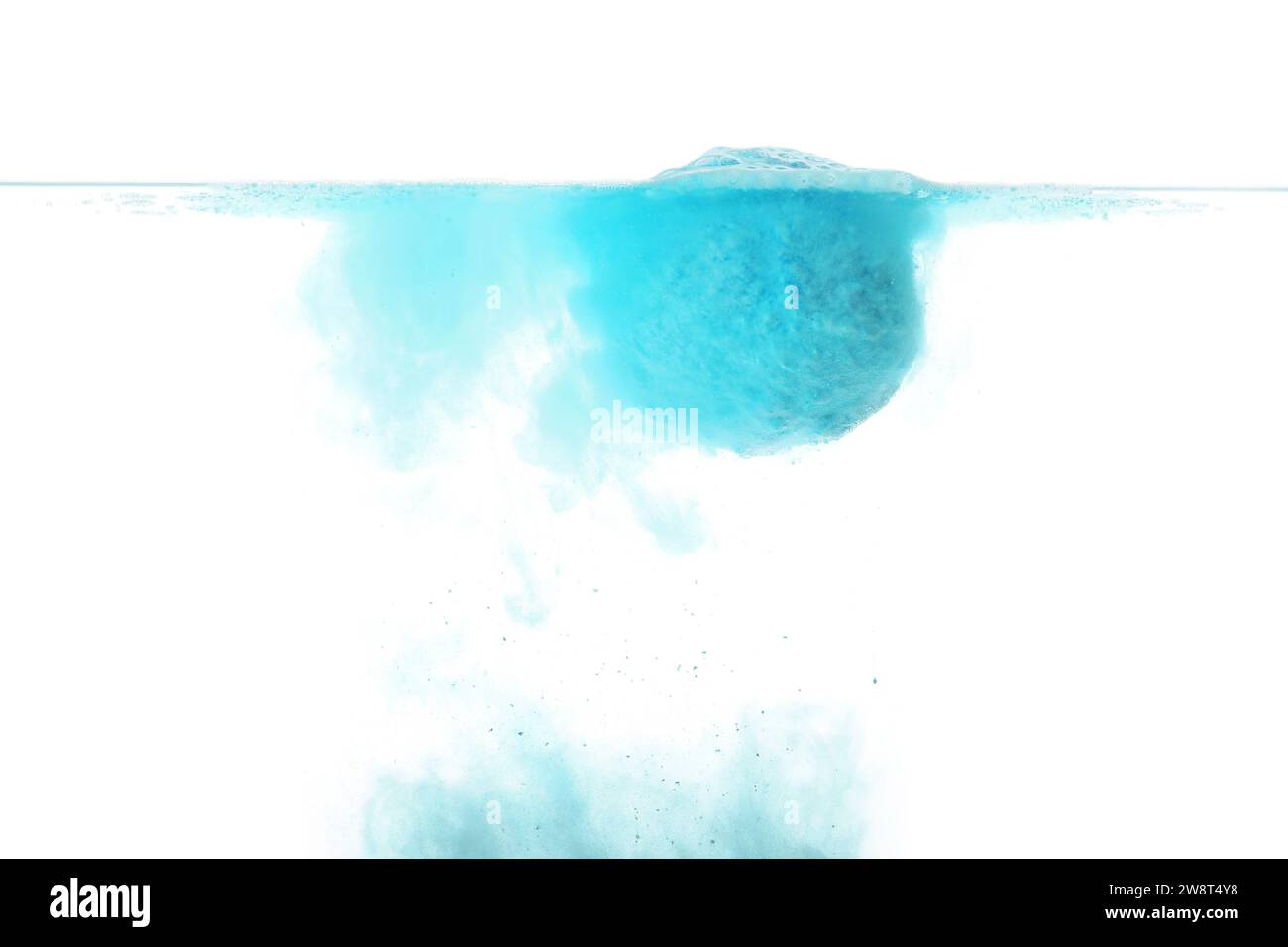 Light blue bath bomb in water on white background Stock Photo - Alamy