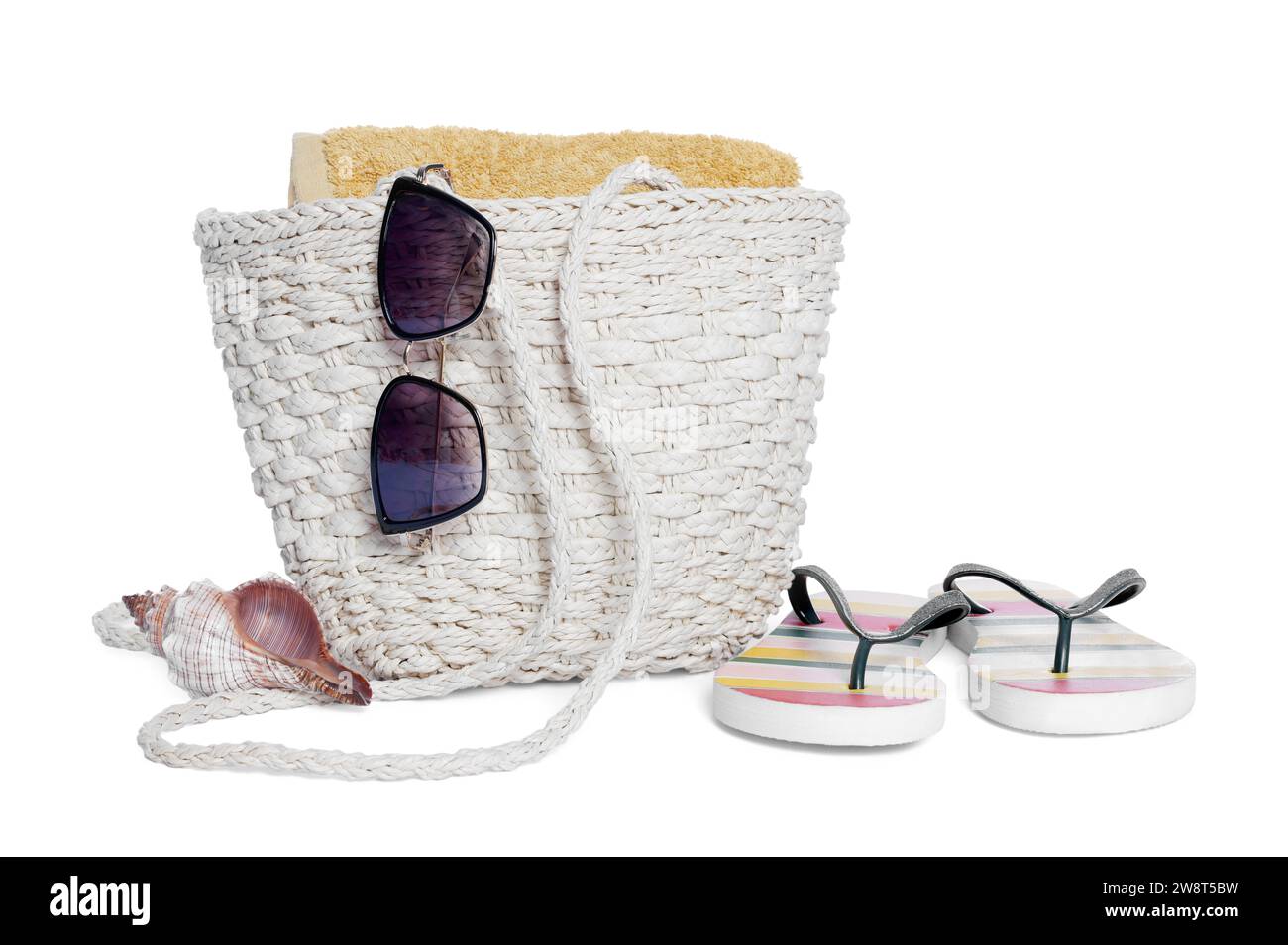 Beach bag, sunglasses, towel, flip flops and sea shell isolated on ...