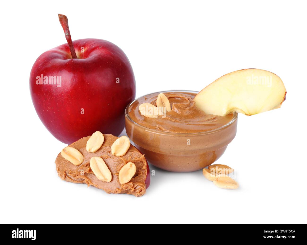 Slices of fresh apple with peanut butter, fruit and nuts isolated on ...