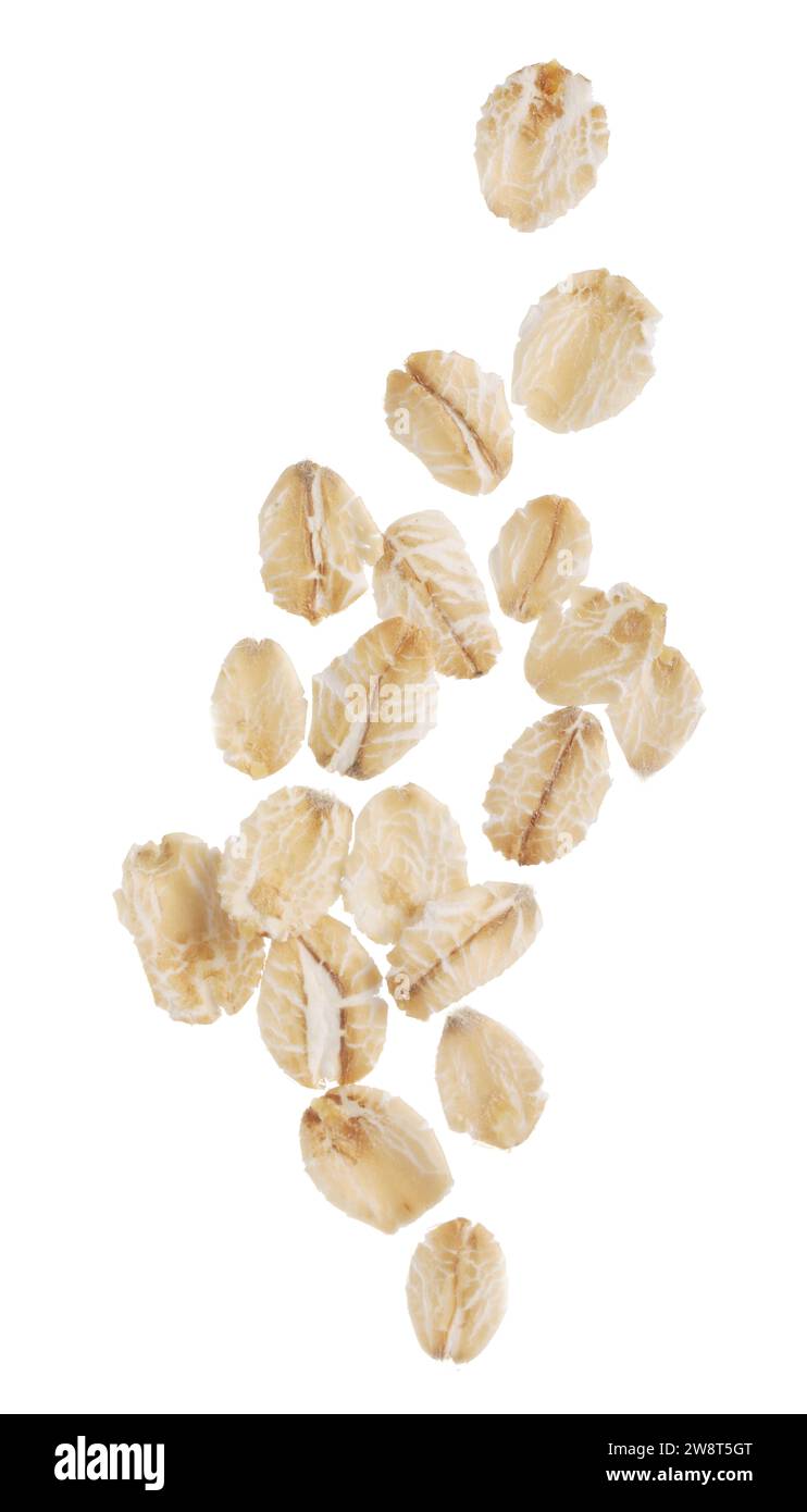 Dry oat flakes falling on white background Stock Photo - Alamy