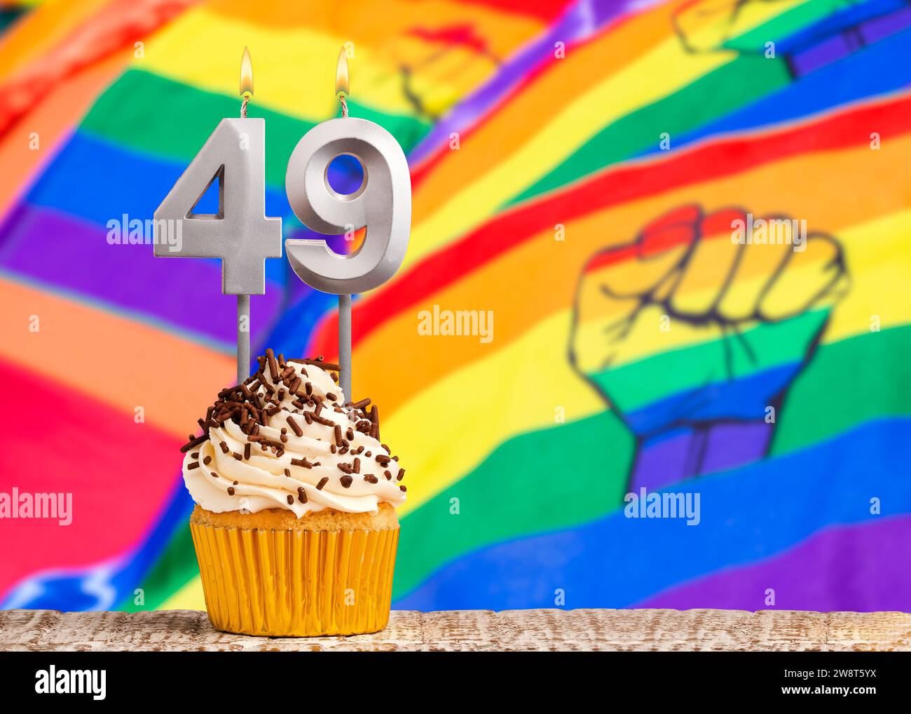 Birthday candle number 49 - Gay march flag background Stock Photo - Alamy