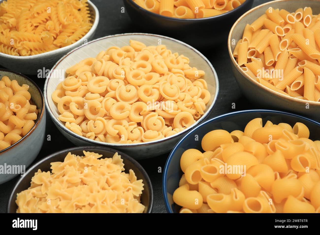 Different types of pasta on table, closeup Stock Photo - Alamy