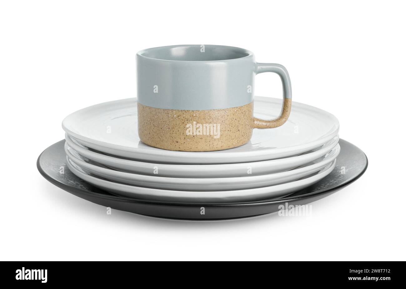 Beautiful ceramic plates and cup isolated on white Stock Photo - Alamy