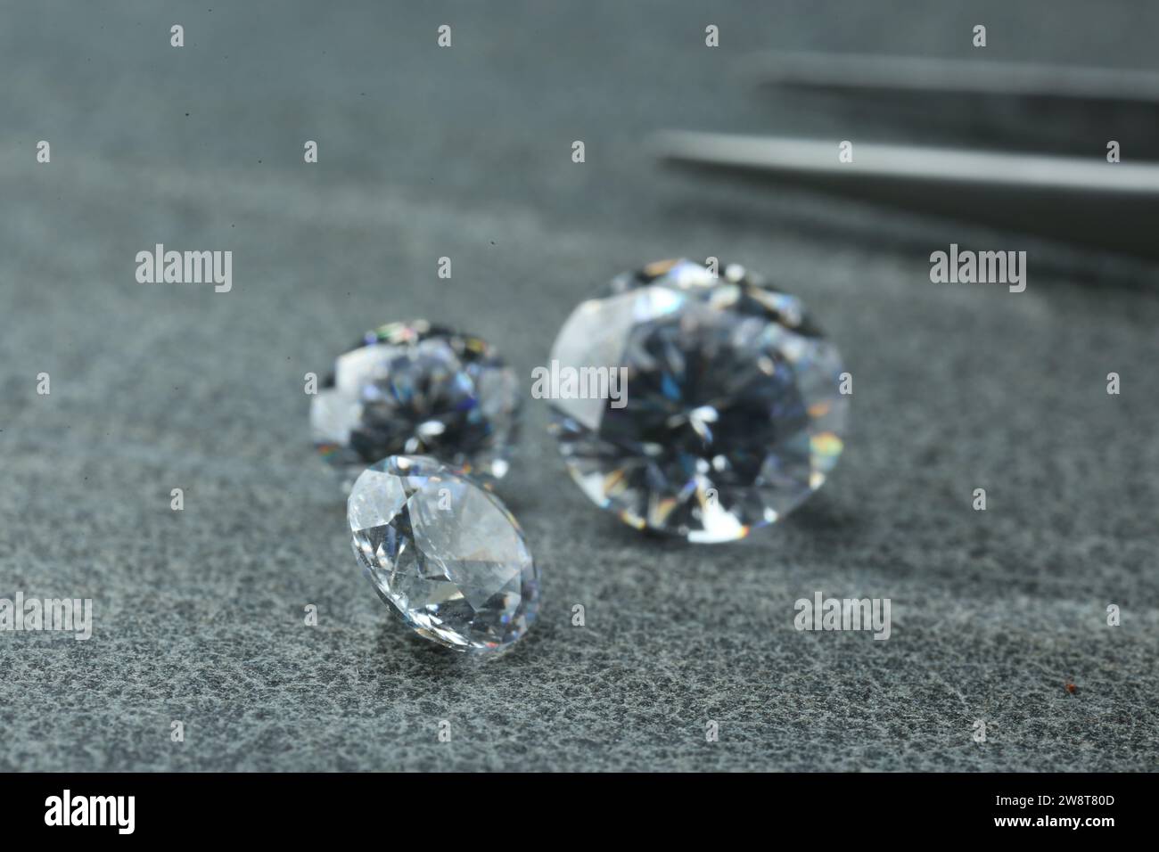 Different beautiful shiny diamonds on grey background Stock Photo - Alamy