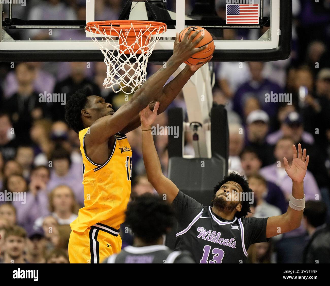 Wichita State center Quincy Ballard (15) shoots under pressure from ...