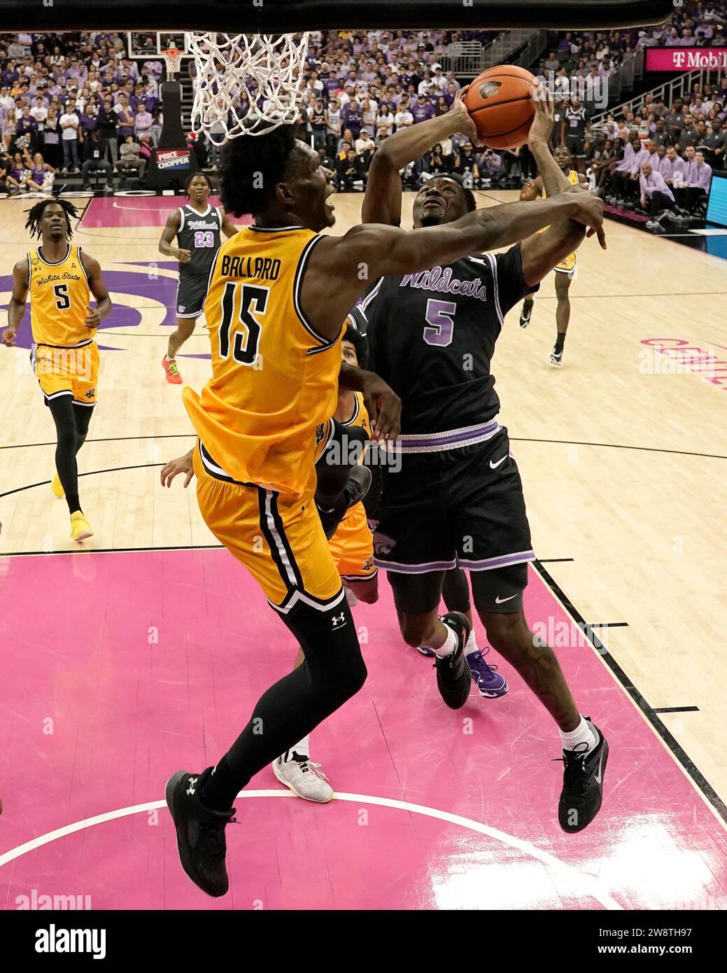 Kansas State guard Cam Carter (5) shoots under pressure from Wichita ...