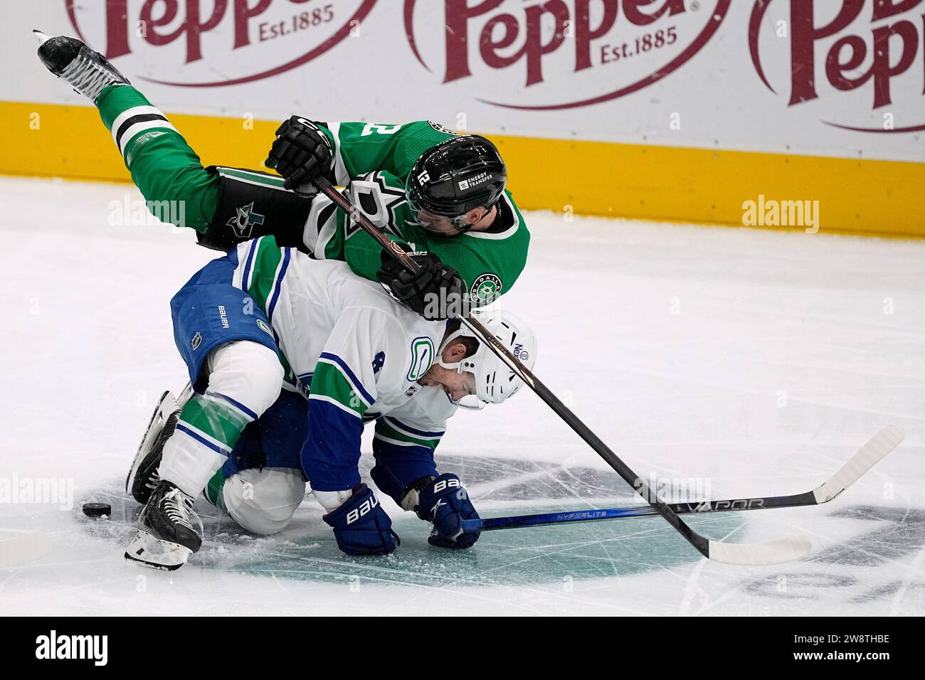 Dallas Stars center Radek Faksa (12) knocks Vancouver Canucks right ...