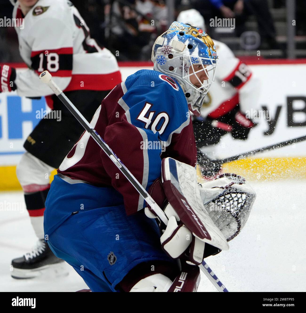 Colorado Avalanche goaltender Alexandar Georgiev, front, stops an ...