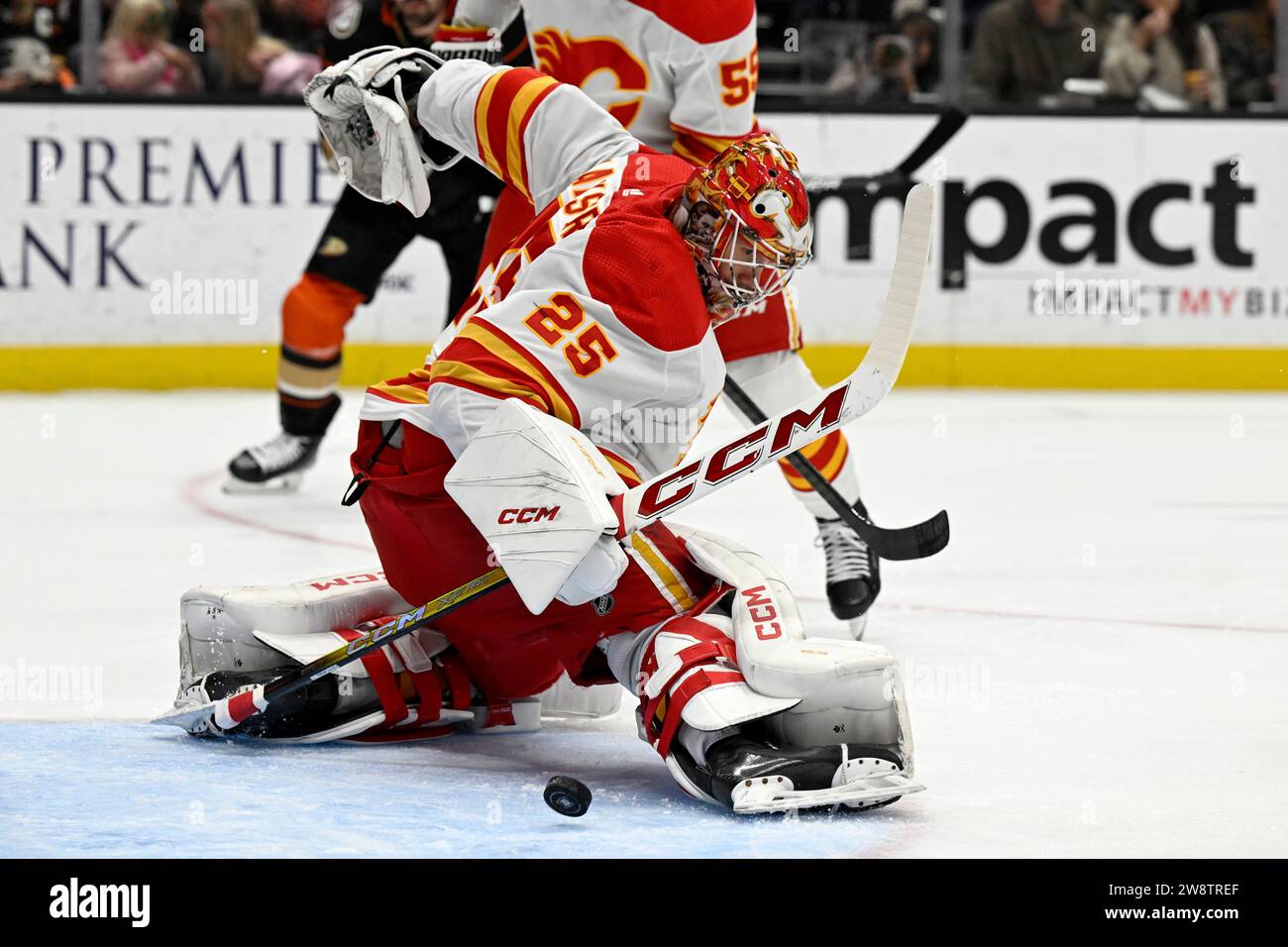 Calgary Flames goaltender Jacob Markstrom (25) deflects a shot by the Anaheim Ducks during the ...