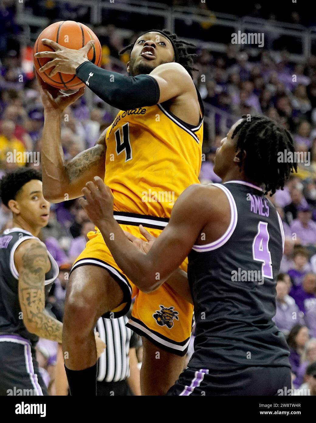Wichita State guard Colby Rogers (4), left, shoots over Kansas State ...