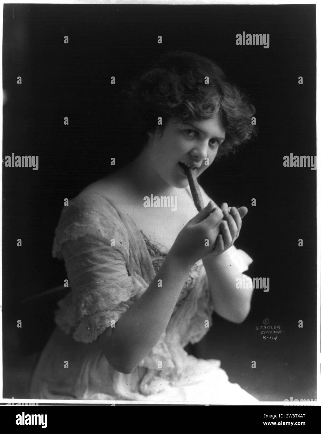 Young woman lighting a cigar Stock Photo - Alamy
