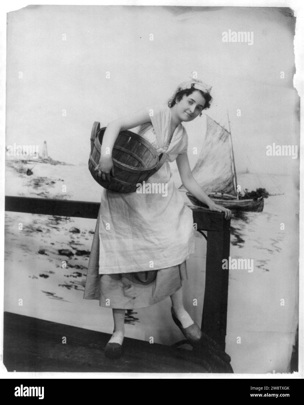 Young women modeling- Full lgth., wearing Dutch costume, holding basket ...