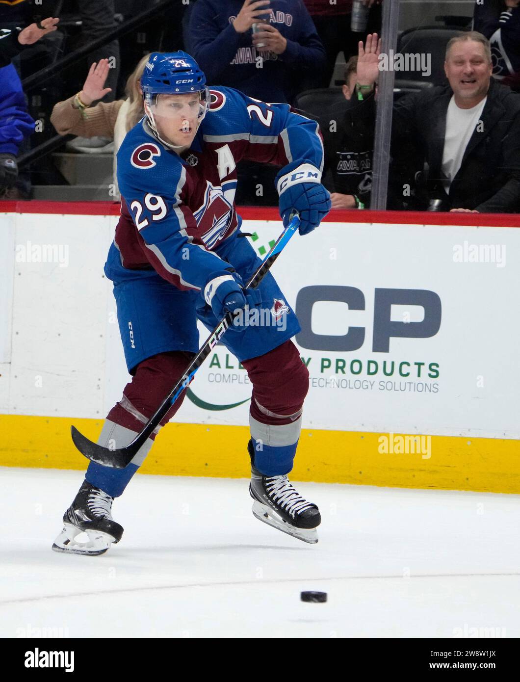 Colorado Avalanche center Nathan MacKinnon shoots for an empty-net goal ...