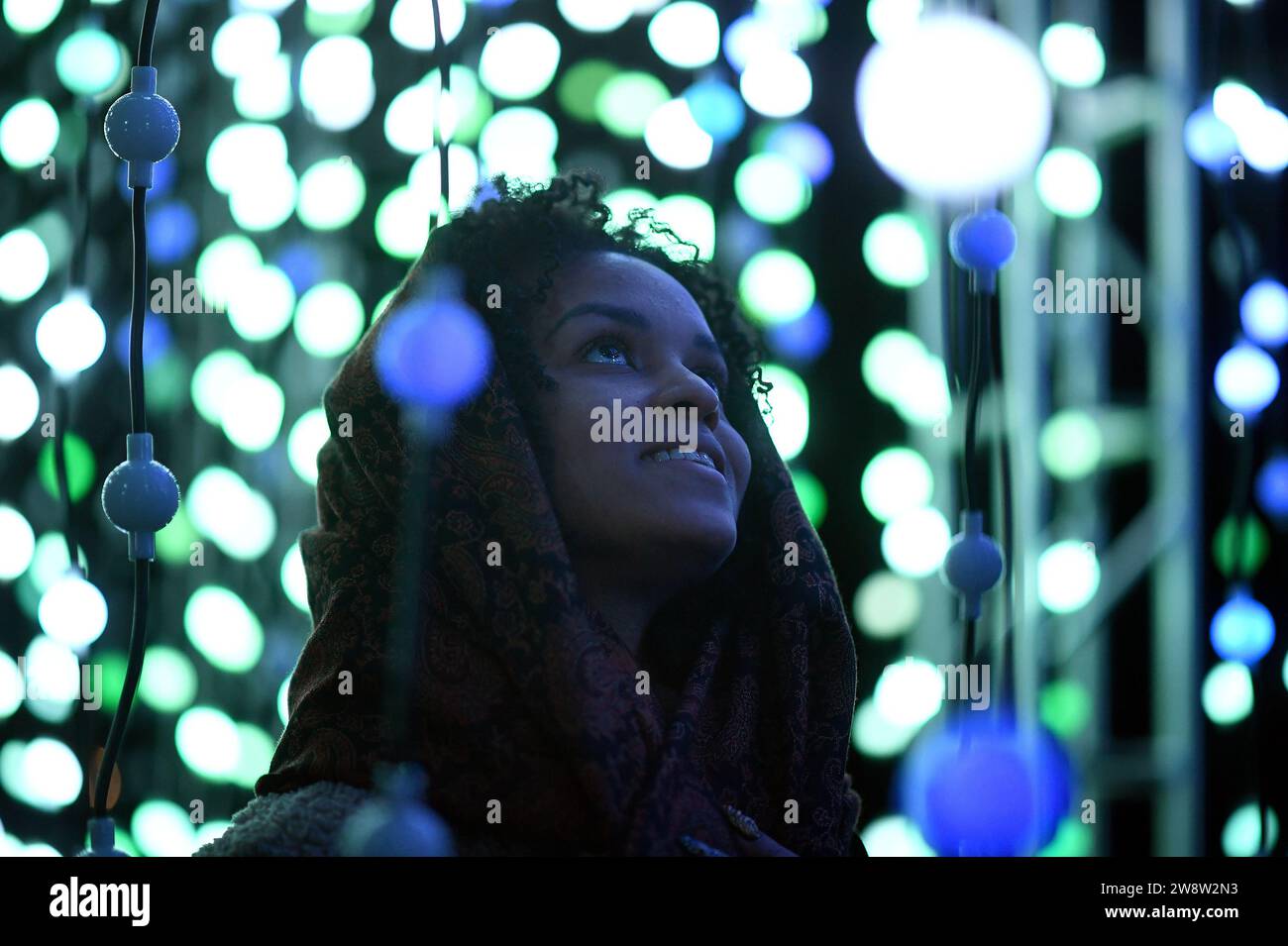 New York, USA. 21st Dec, 2023. Simone Martin walks through 'Submergence ...