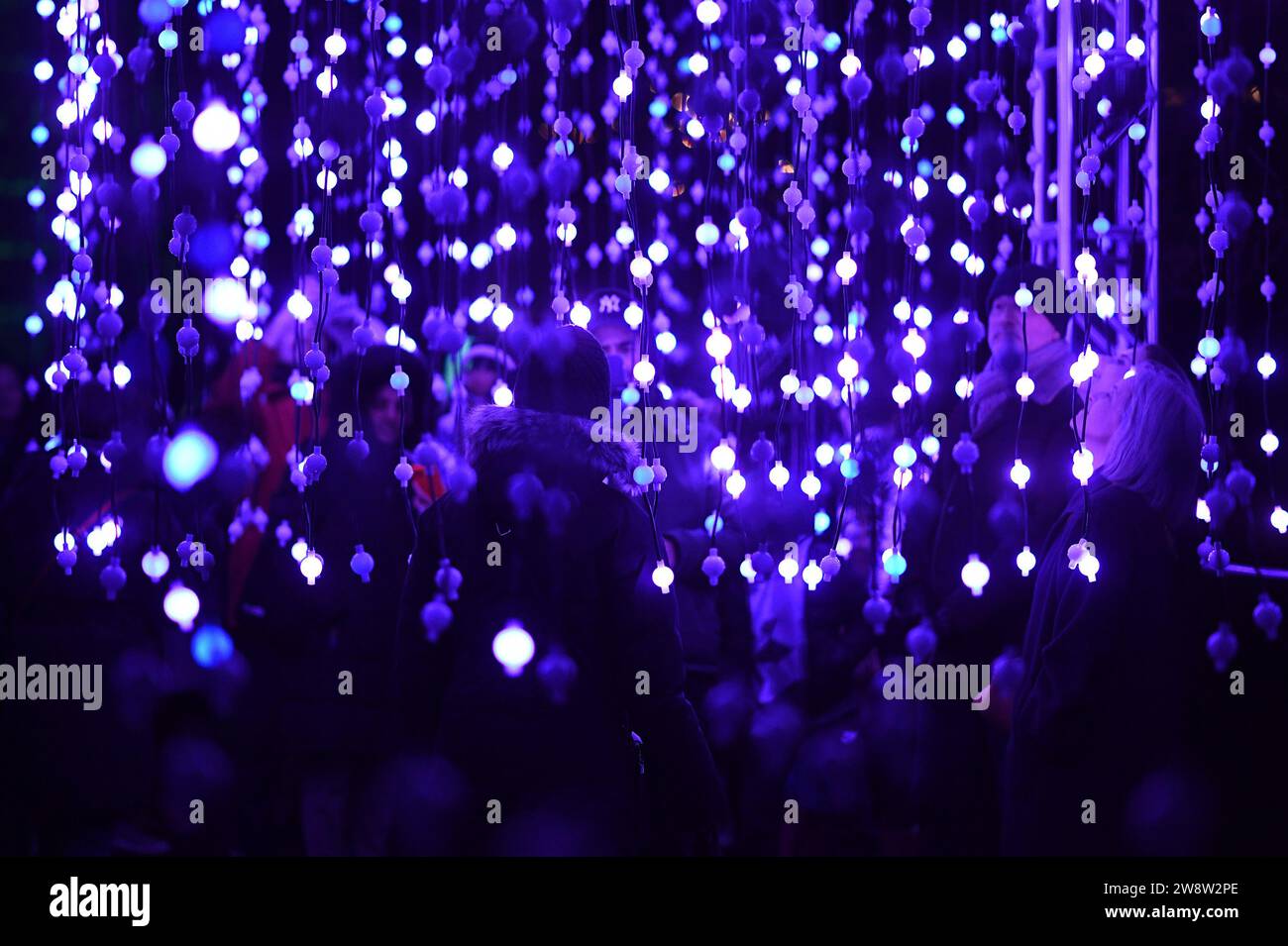 New York, USA. 21st Dec, 2023. People walk through 'Submergence' by ...