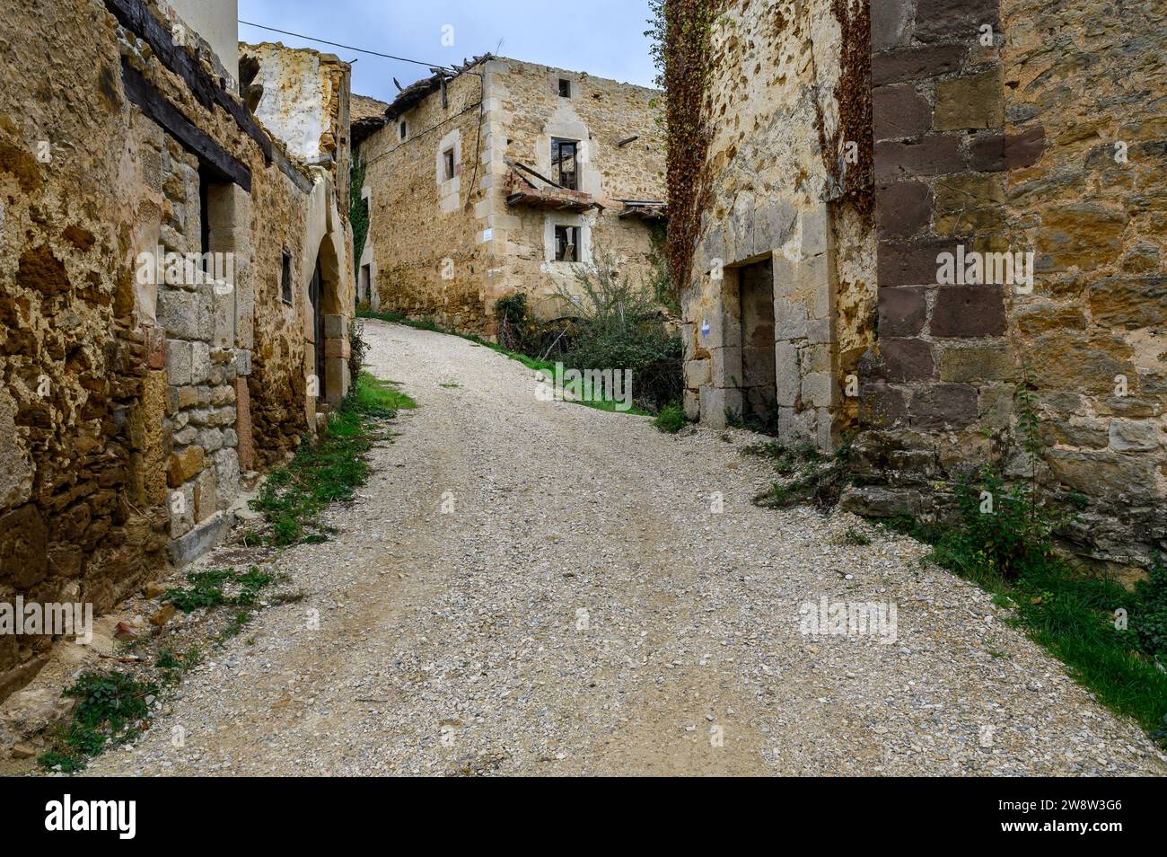 "Close-up of an unpaved street in a Burgos village, Tamayo, in ruins ...