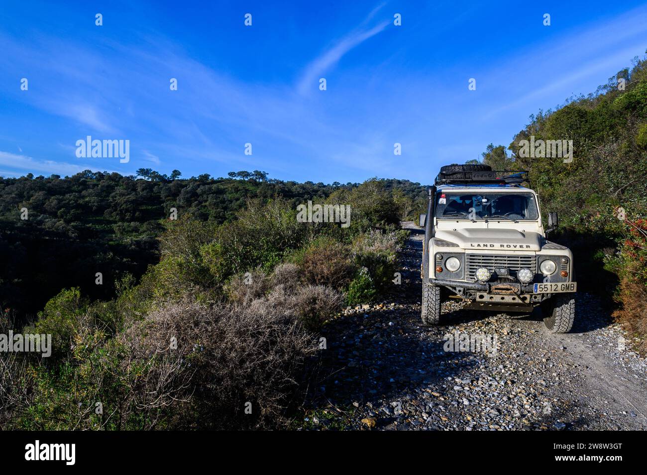 White Land Rover Defender equipped for 4x4 and overland travel, with a ...
