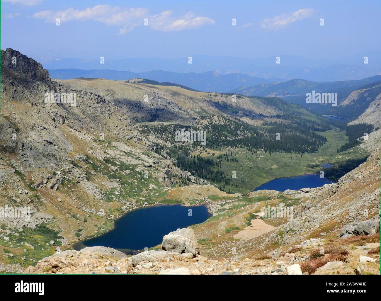 looking down at the upper and lower chicago lakes from the hiking trail ...