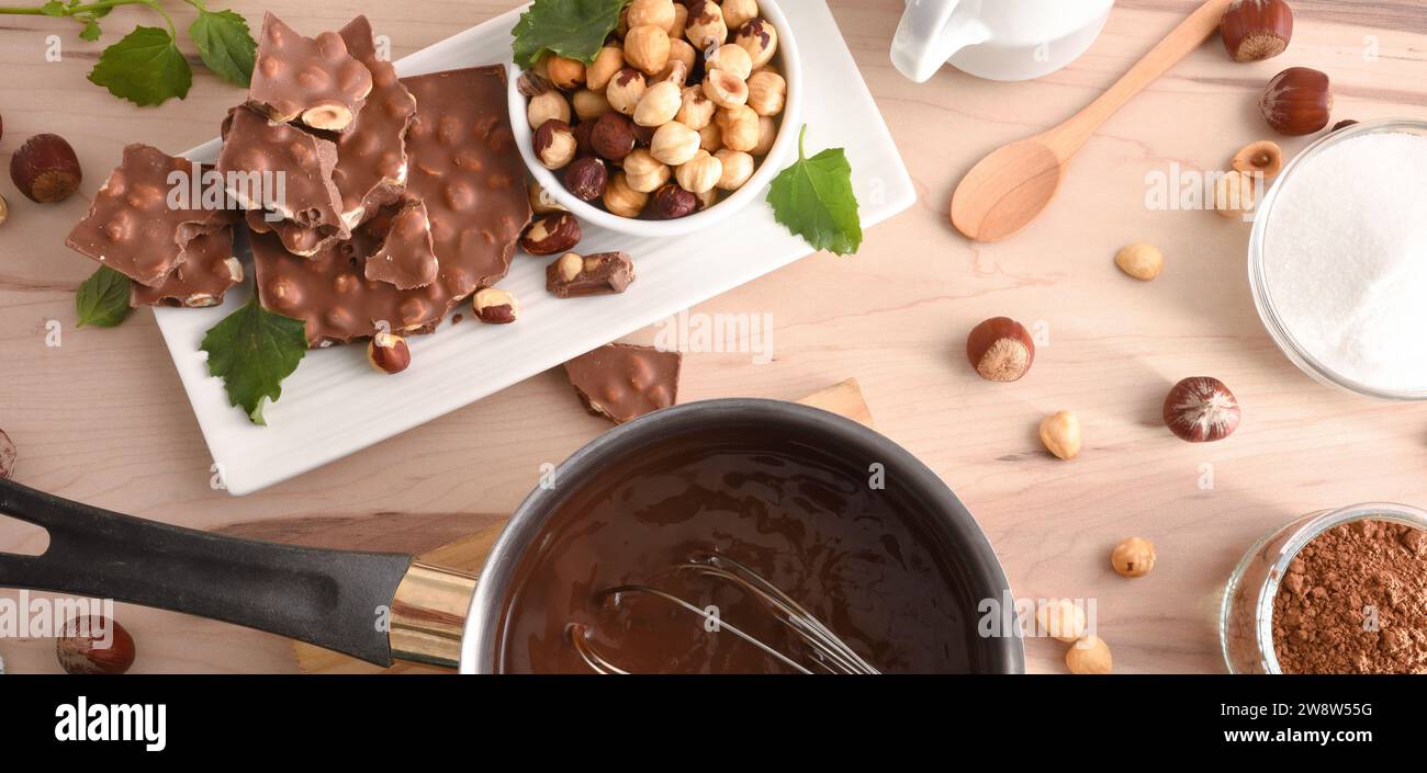 Wooden kitchen bench with ingredients and tools for making chocolate ...