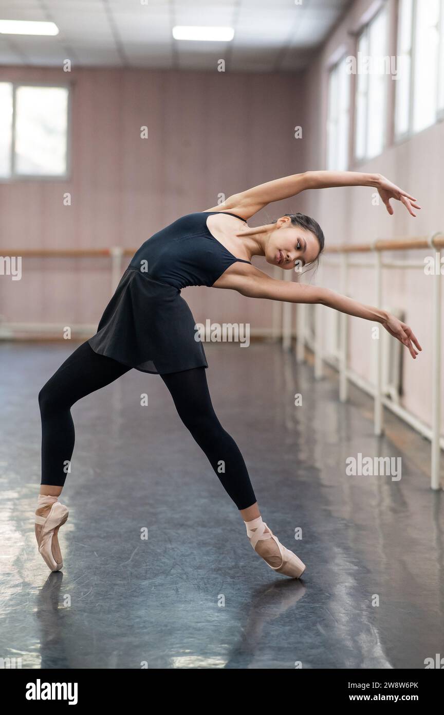 Asian woman dancing in ballet class. Bending in the back Stock Photo ...