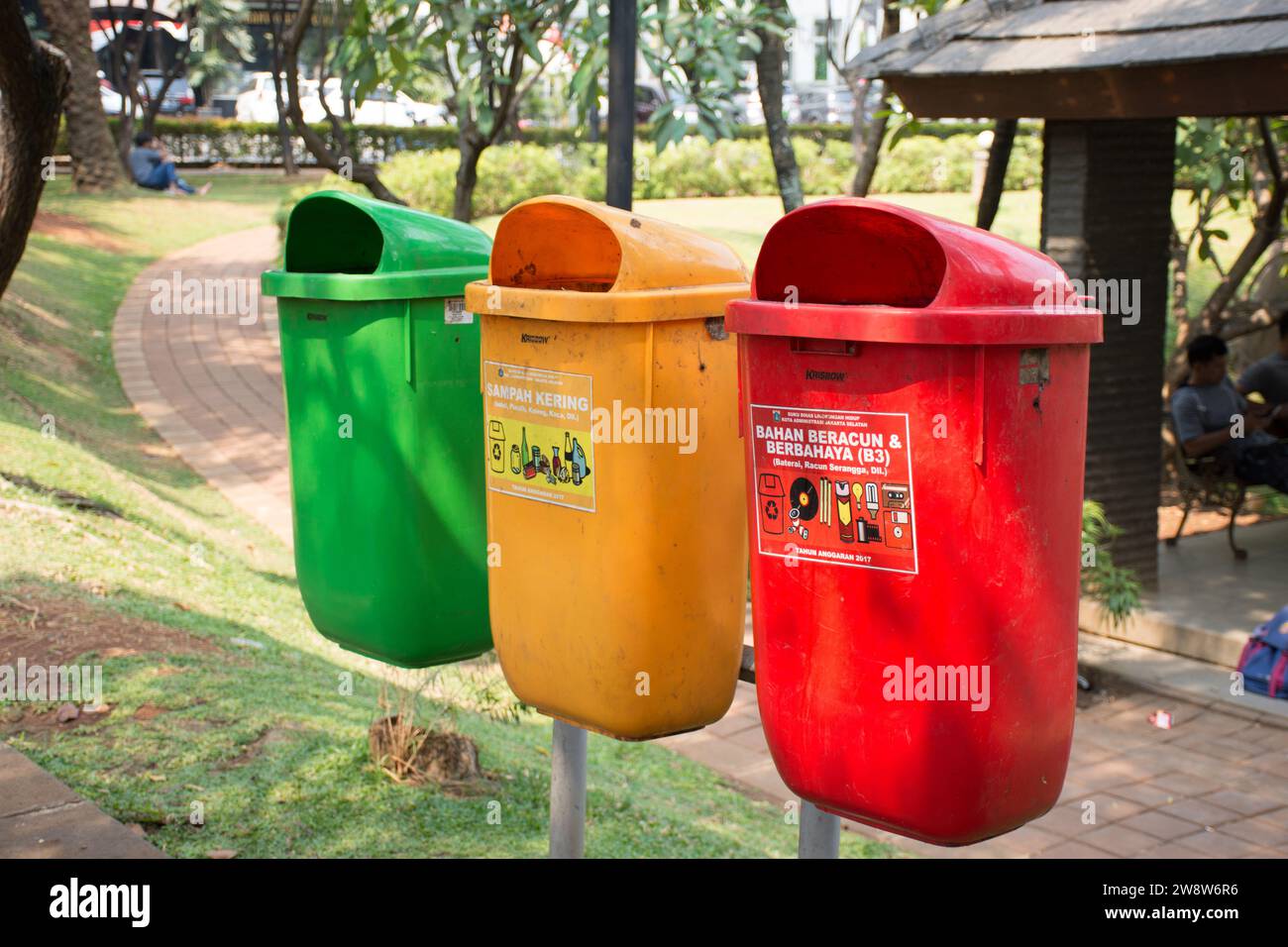 Color-coded Waste Bins for Environmental Sustainability in a Park Setting Stock Photo - Alamy