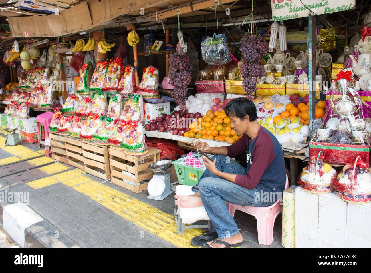 Vibrant Flavors of Java: Fresh Fruits and Friendly Faces Stock Photo ...