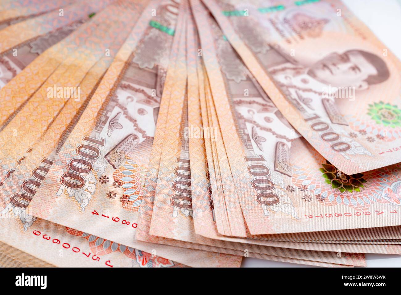 Heap of Thai 1,000 baht banknotes issued by the Bank Of Thailand Stock ...