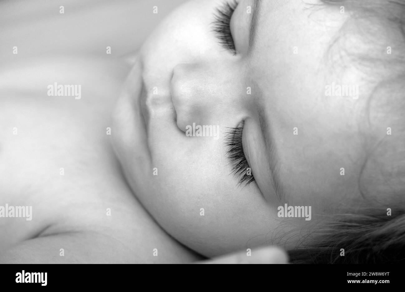 Close up face of baby child sleeping in the bed. Closeup sleepy kids ...