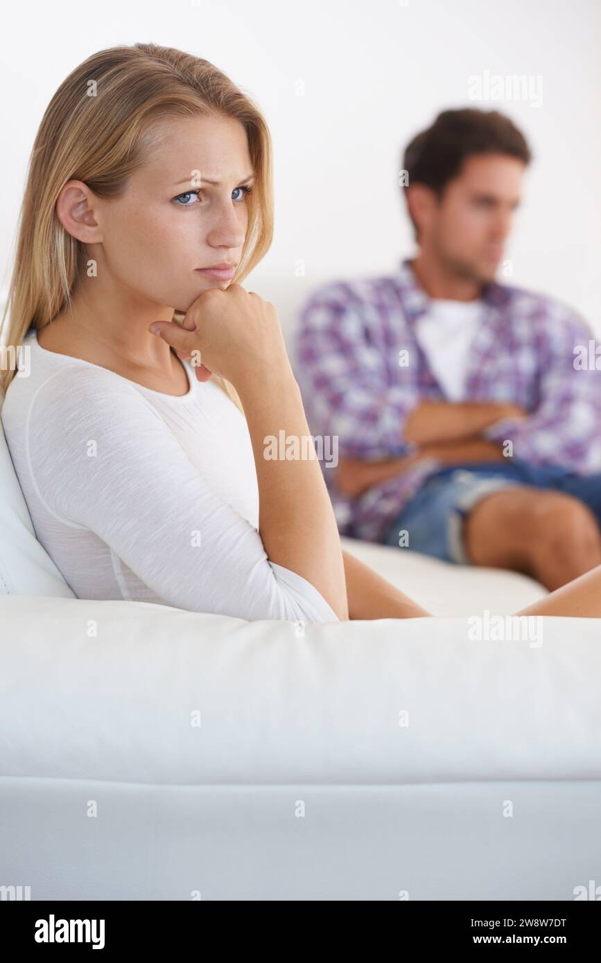 Couple, angry and living room couch with anger, upset and thinking with ...