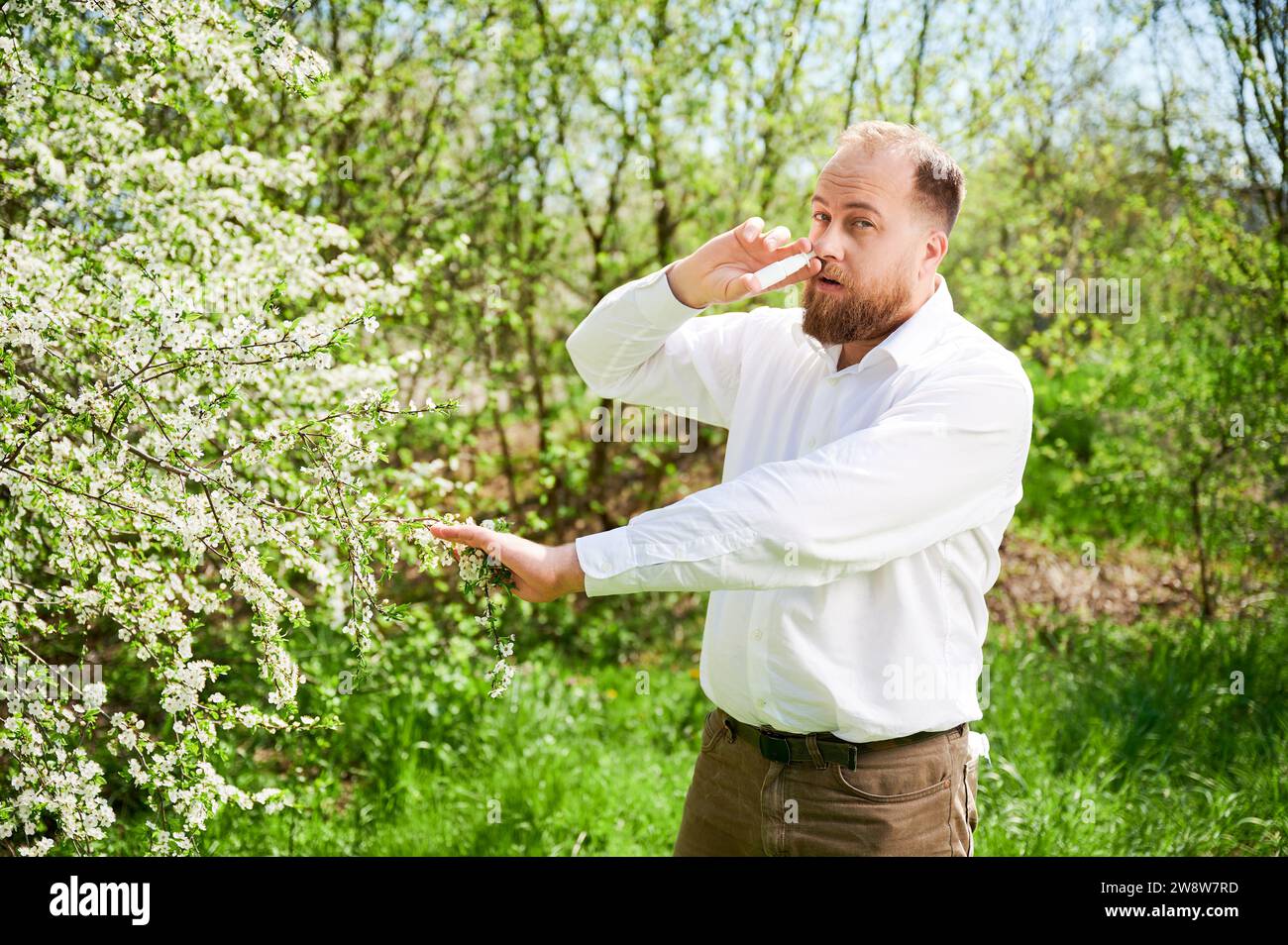 Man allergic using medical nasal drops, suffering from seasonal allergy ...