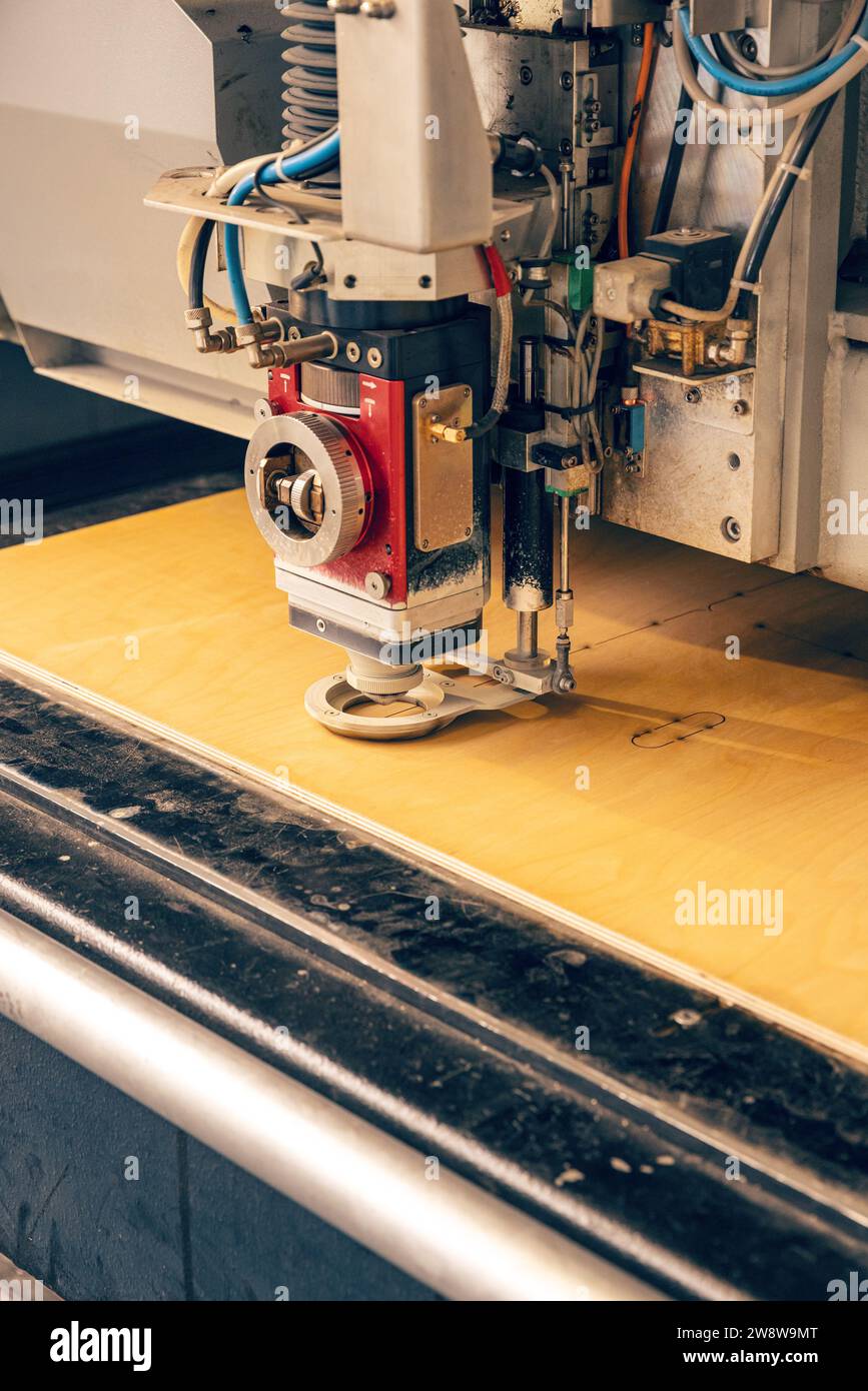 Industrial laser cutter. Laser cutting process of wood Stock Photo - Alamy
