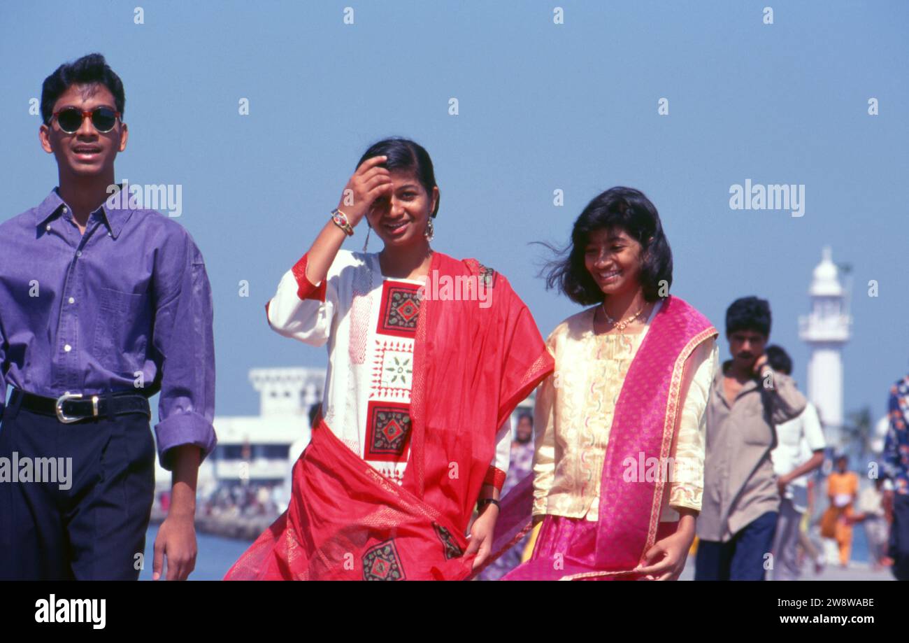 India: Visitors at Haji Ali Mosque and Dargah, Worli Bay, Mumbai. The ...