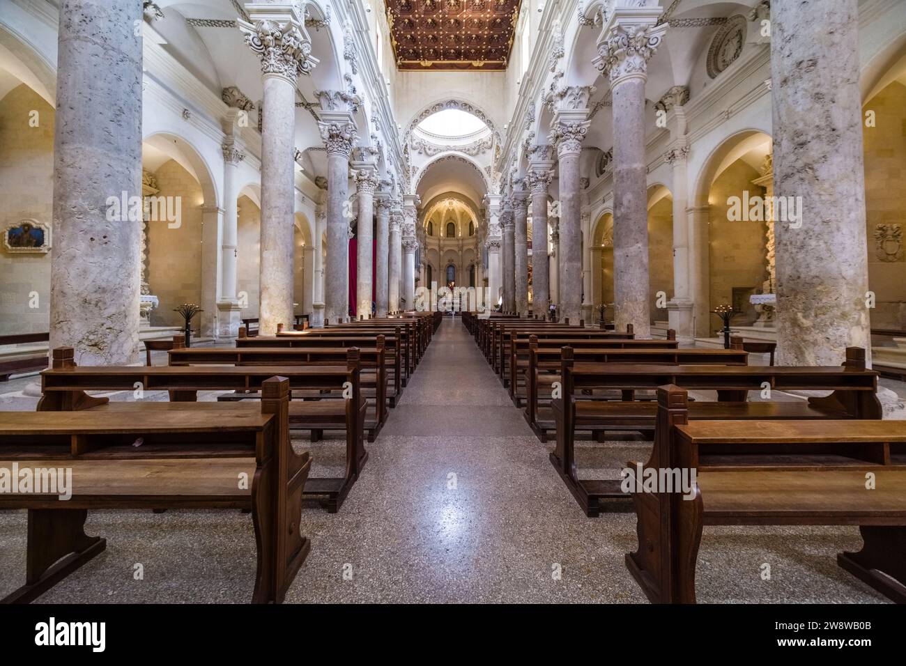 Interior design, collumns, prayer benches and altar inside the church ...