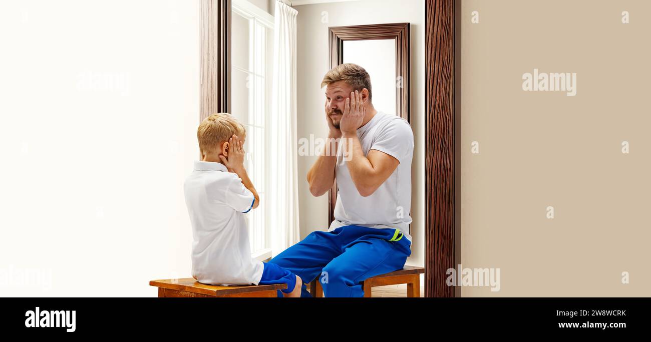 Little boy, child sitting and looking in mirror at reflection of future ...