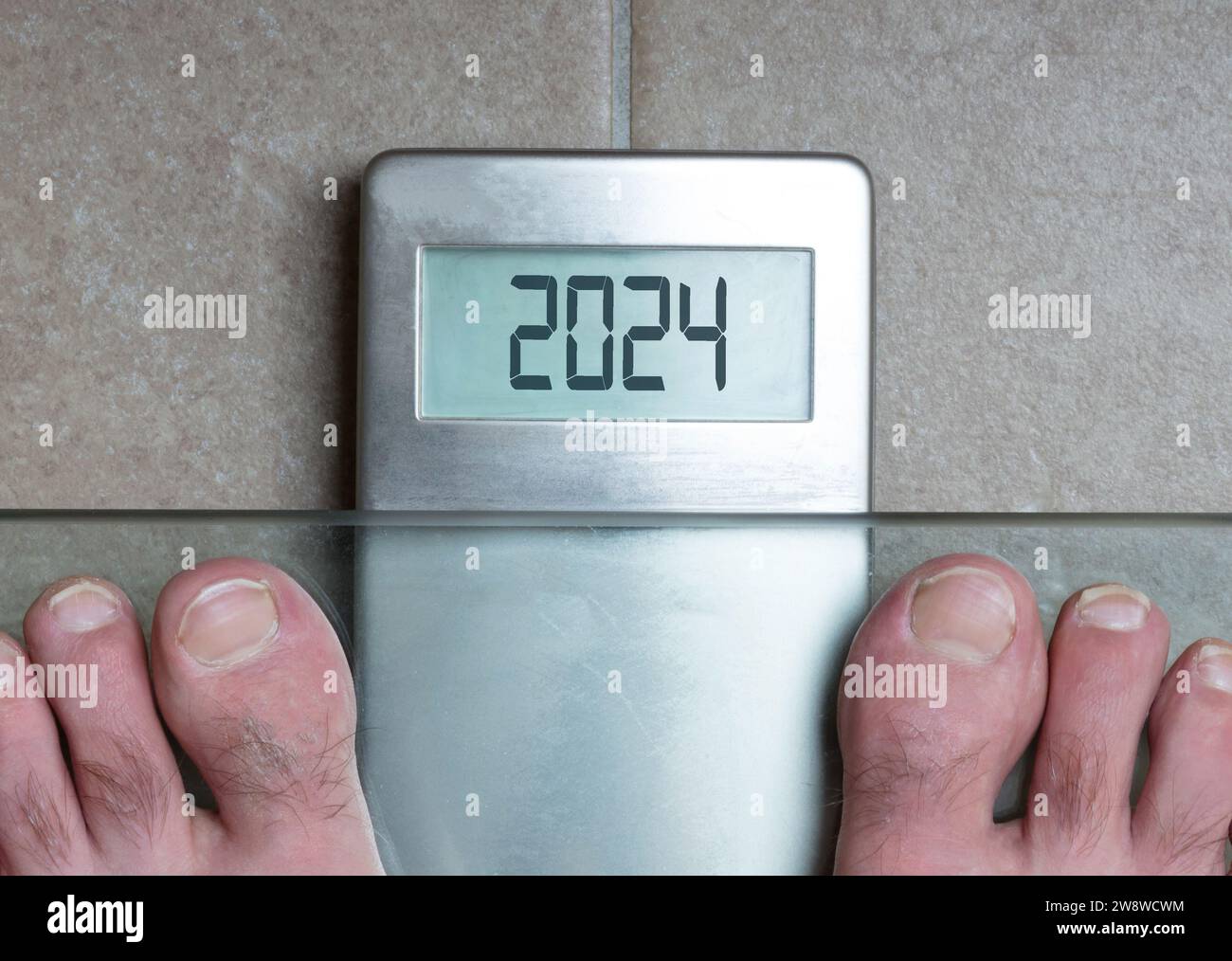 Scales saying 2024; new year, new intentions, isolated Stock Photo - Alamy