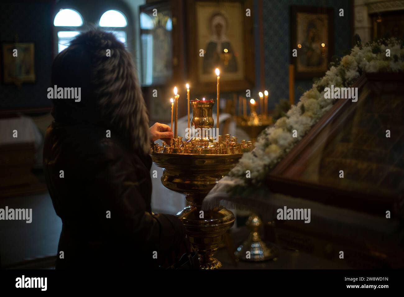 A woman in an Orthodox church. The Girl Inside the Church. Religious ...