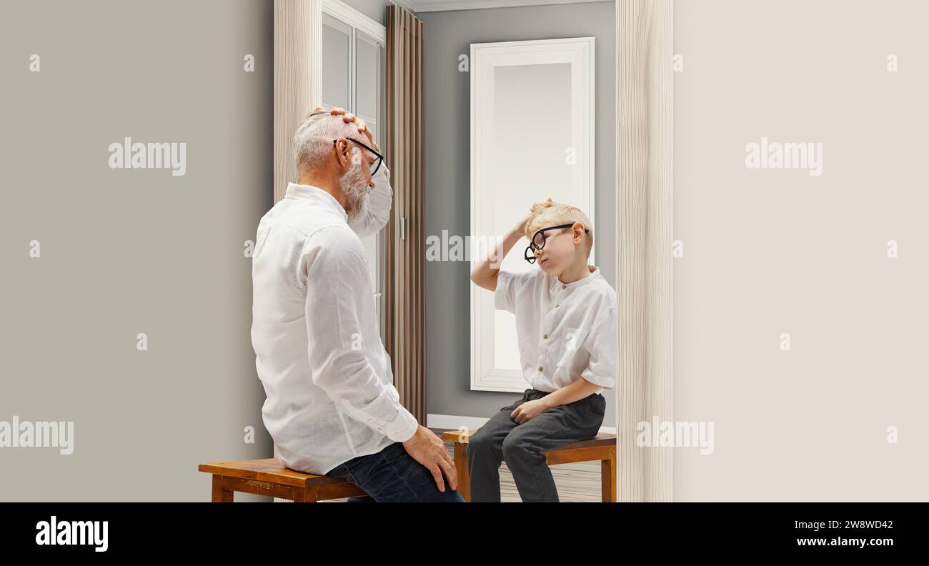 Years ago. Senior man sitting ear mirror with reflection of him as a ...