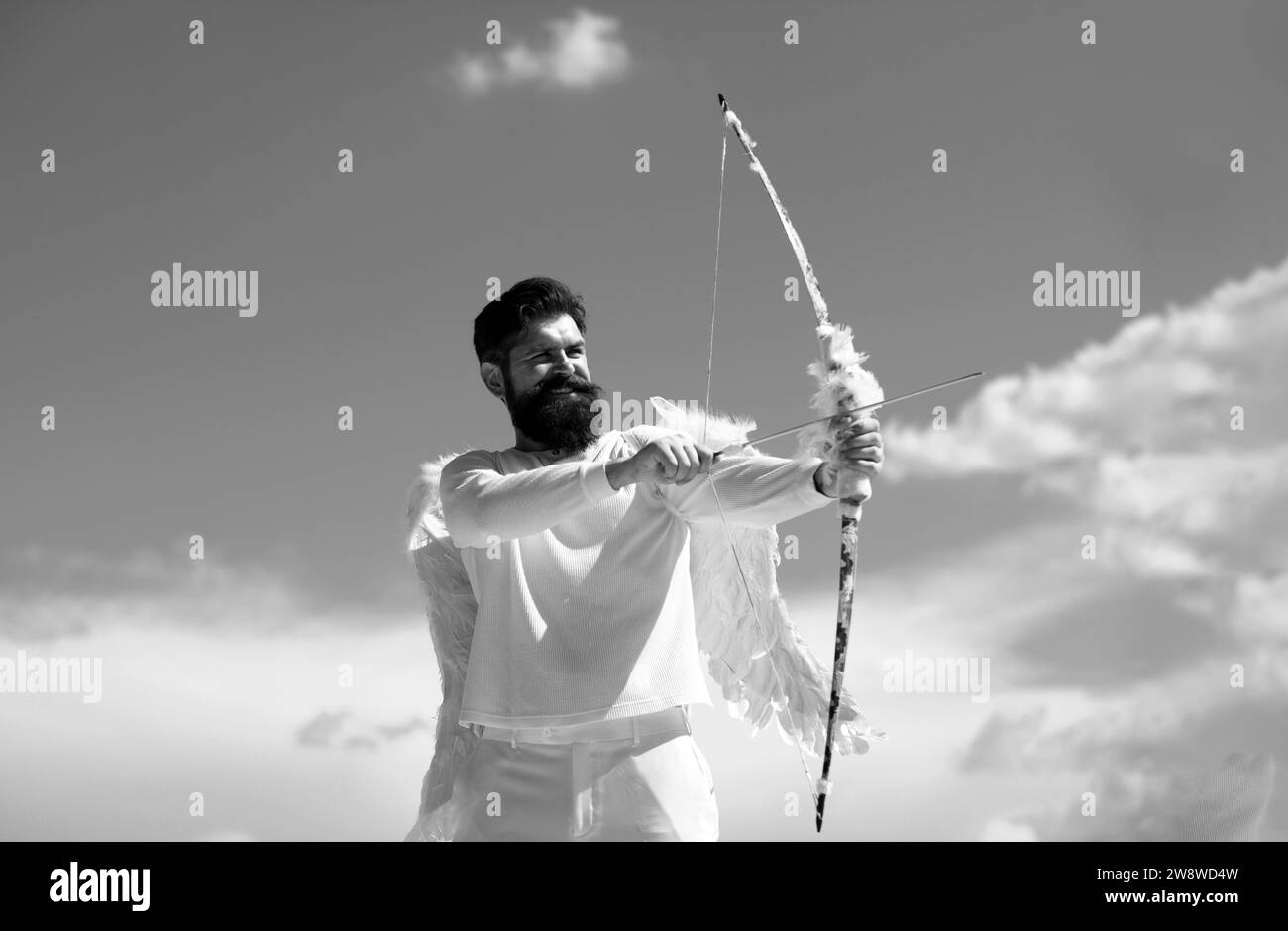 Valentines Day. Crazy bearded angel man aiming with the arrow Stock ...