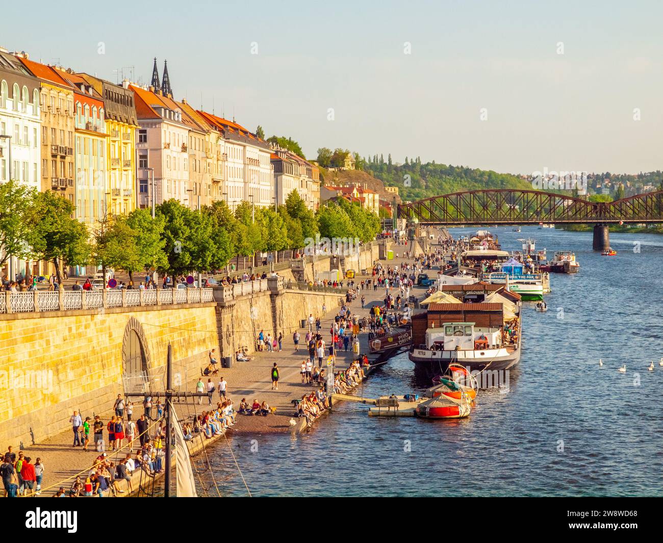 Crowded Rasin Embankment at Vltava river in Prague, Czechia Stock Photo ...