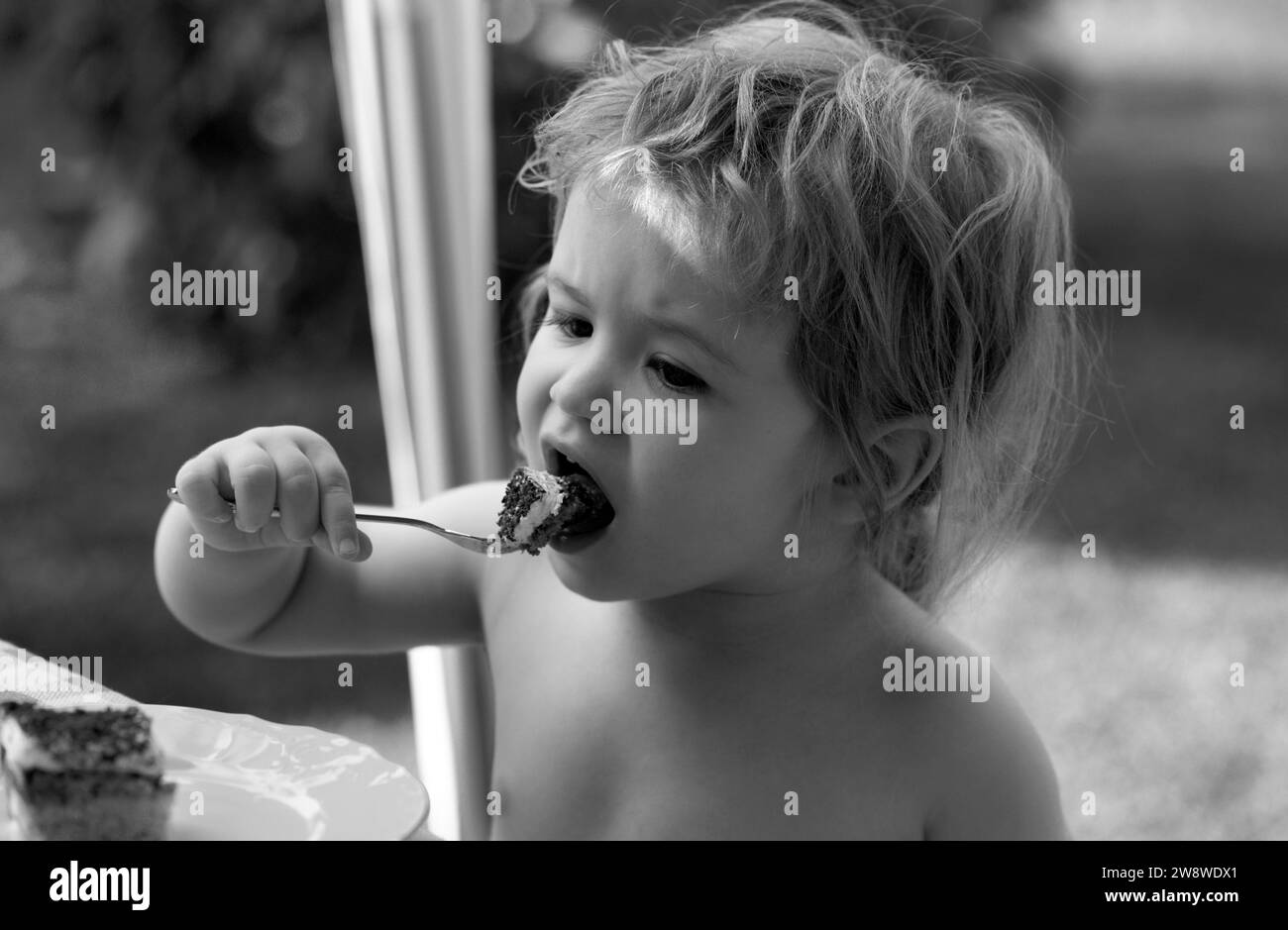 Cute kids eating breakfast Black and White Stock Photos & Images - Alamy