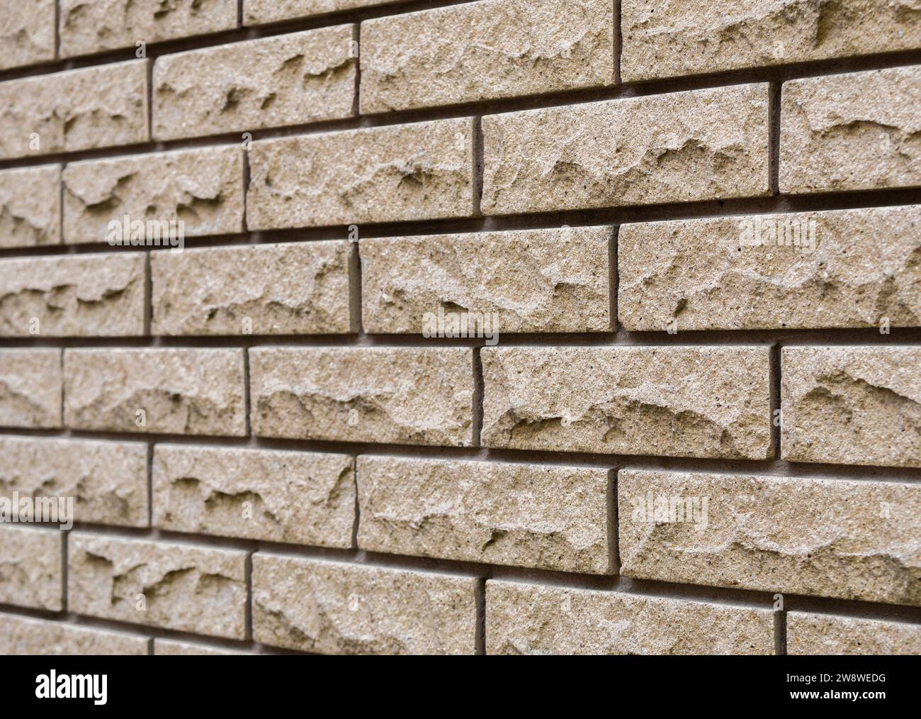 Angled view of the textured surface of clinker brickwork with deep ...