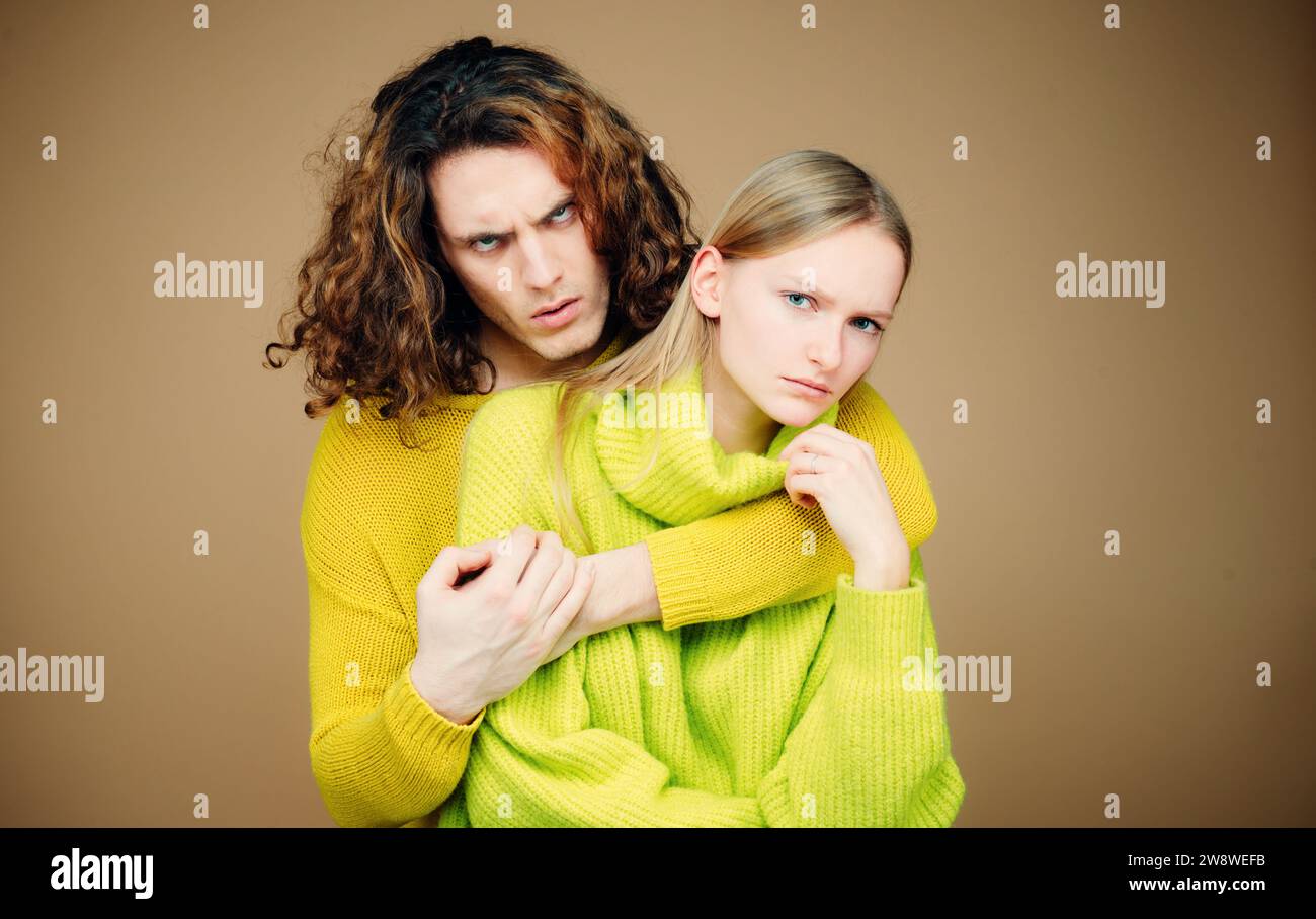 Dissatisfied of young couple hugging. Family conflict discord of two ...