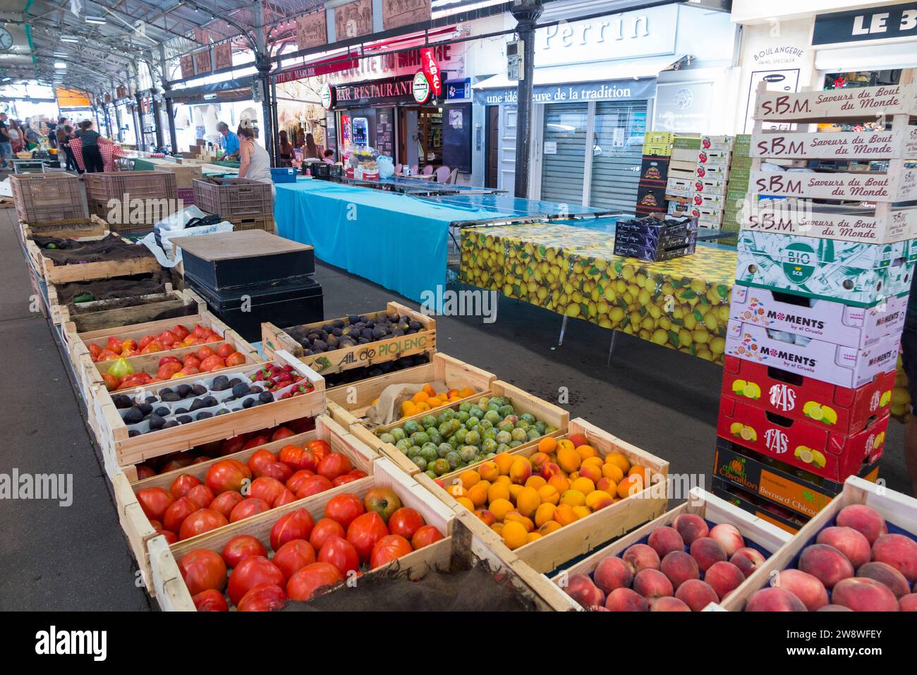 Covered food / fruit street market with stalls selling fruits and veg ...