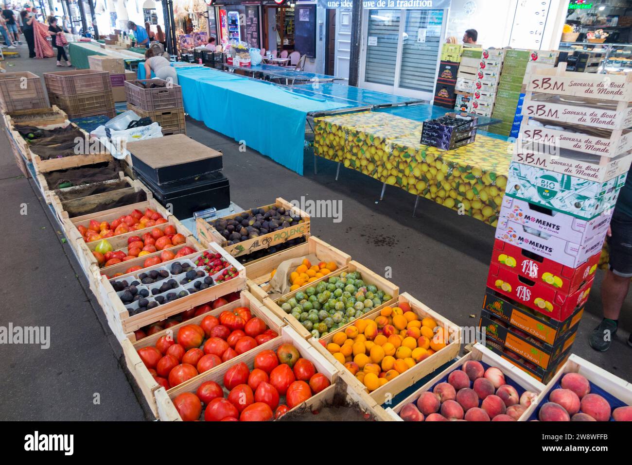 Covered food / fruit street market with stalls selling fruits and veg ...